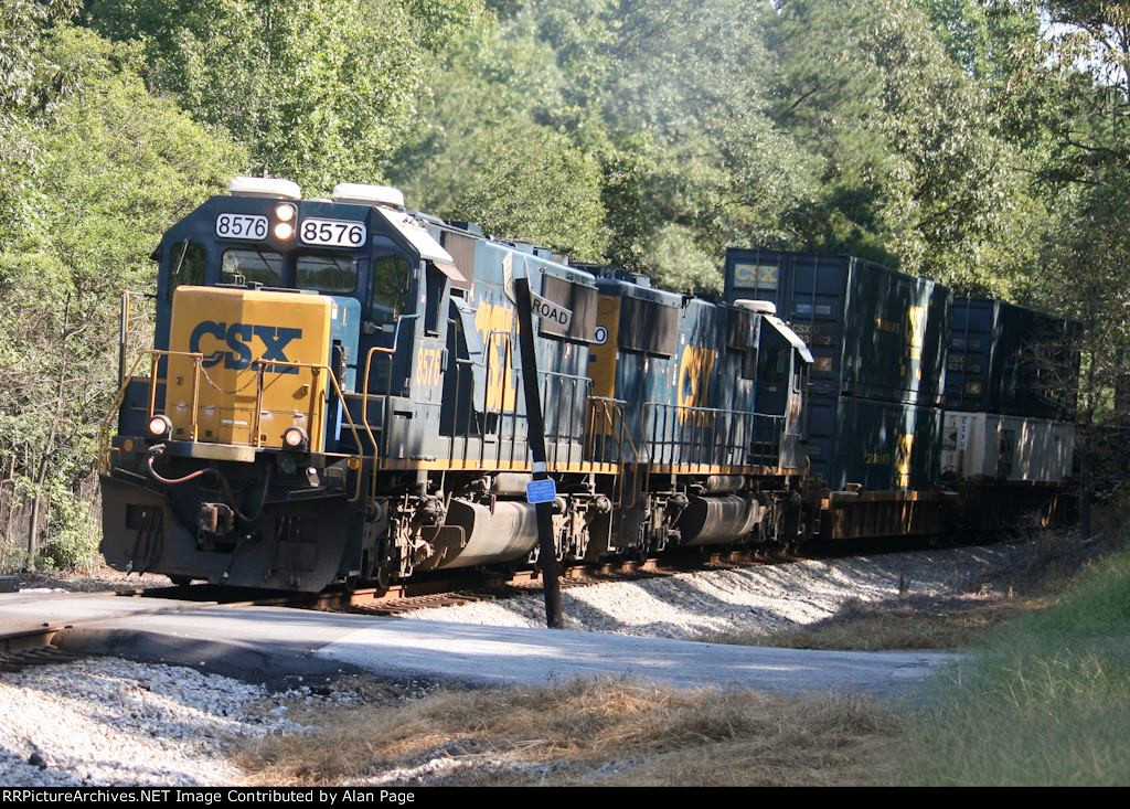CSX SD50-2's 8576 and 8520 are working hard as they cross Westbrook Road